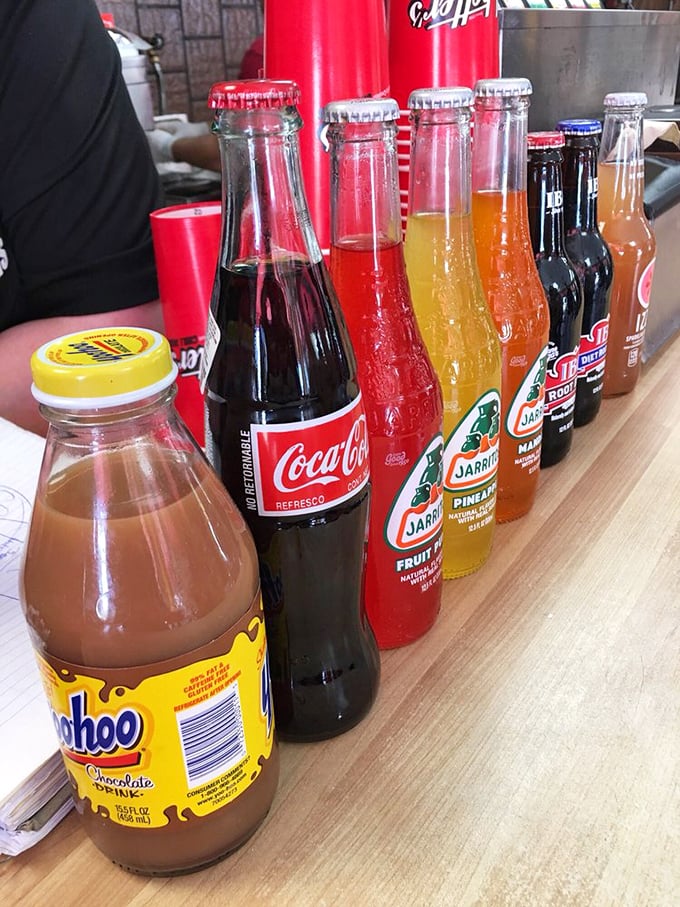 The beverage lineup features glass-bottled sodas that transport you back to simpler times when "artisanal" meant "tastes really good."