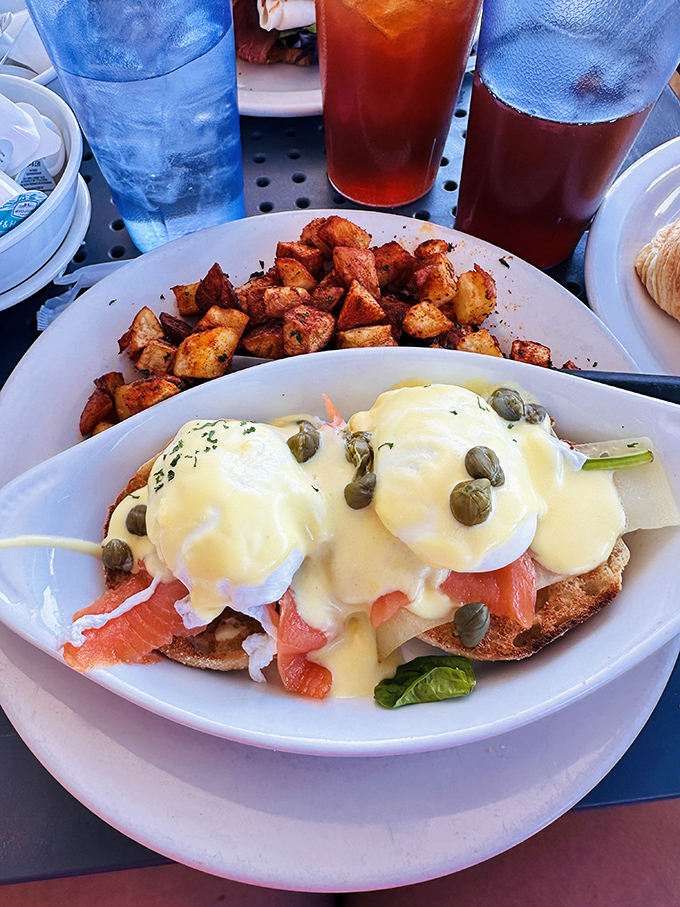 Eggs Benedict elevated to an art form&mdash;poached eggs perched atop smoked salmon with hollandaise cascading like a buttery waterfall.