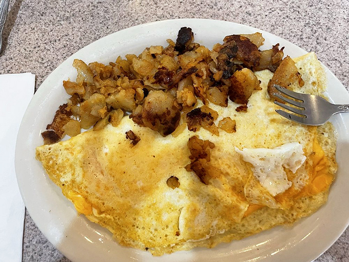 The perfect omelet doesn't hide its ingredients&mdash;it celebrates them. Those home fries on the side? They're the unsung heroes of breakfast plates everywhere.