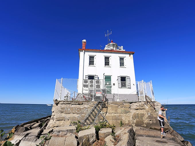 The lighthouse entrance says "keep out" but the view says "come closer"&mdash;the eternal contradiction of these beautiful beacons that both welcome and warn.
