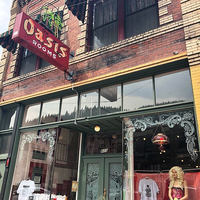 The Oasis Rooms sign hints at Wallace's colorful past, now a museum where visitors can glimpse the town's more risqu&eacute; history with a wink and a nod.