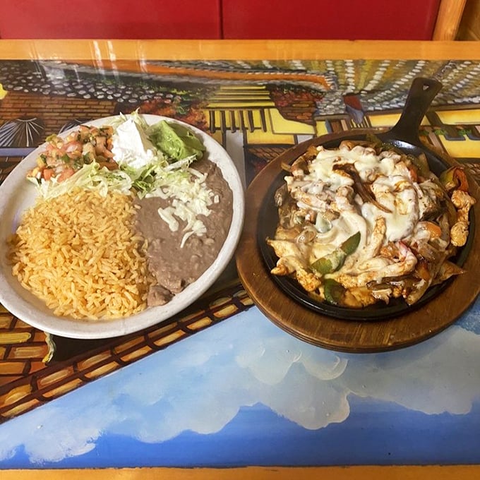The sizzling fajita platter arrives like a rockstar with its own soundtrack. Meanwhile, the rice and beans sit quietly, knowing their supporting role is crucial.