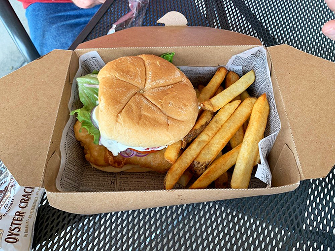 The fish sandwich&mdash;where British tradition meets American practicality. Hand-held happiness with that same perfect batter, proving good things come between bread slices too.