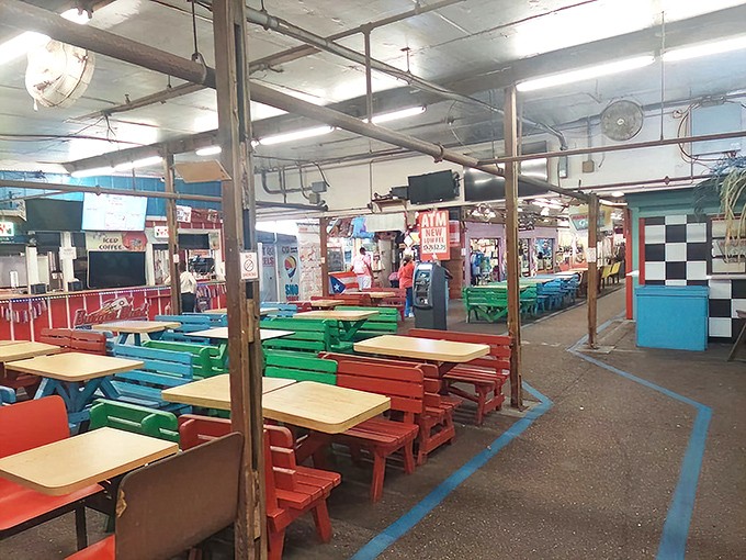 A rainbow of picnic tables creates the perfect backdrop for the universal flea market fuel: comfort food that hits the spot after hours of browsing.