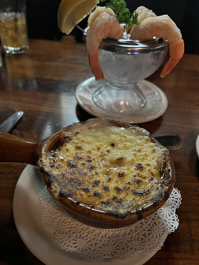 Behold the bubbling masterpiece that is French onion soup. That golden, crusty cheese top is the entrance to a savory, oniony paradise below.