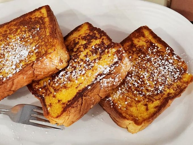 French toast that makes you question why you've wasted years eating lesser versions. This is what bread dreams of becoming.