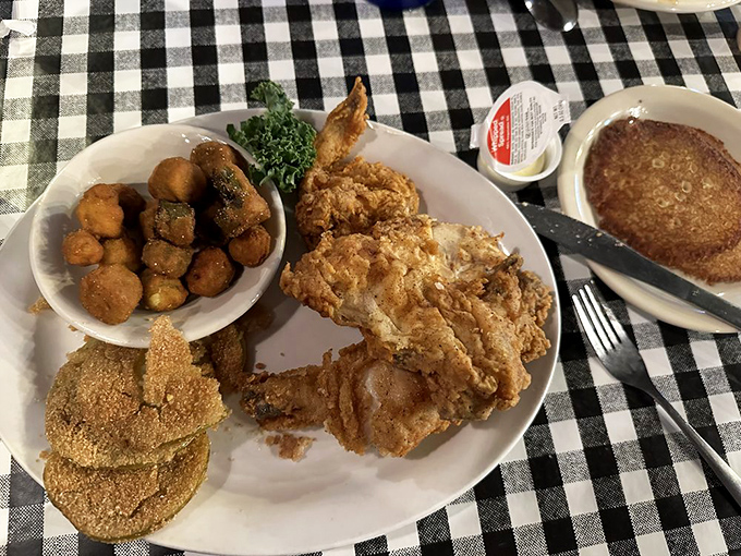 Fried chicken so perfectly golden it deserves its own trophy, accompanied by sides that refuse to be overshadowed. This is equality on a plate.