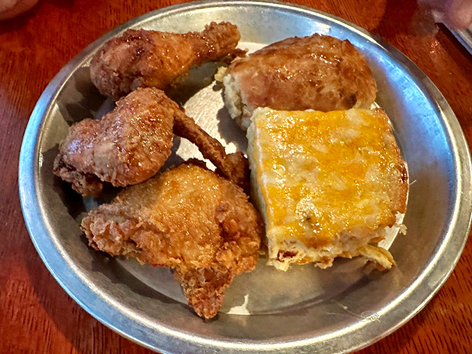 Some people dream of gold, others of this golden-fried chicken nestled beside a square of pimento mac that could make a grown person weep.
