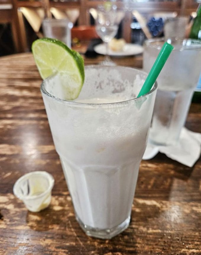 This isn't just a refreshing beverage; it's Miami's tropical climate captured in a glass, complete with a lime lifeguard standing watch.