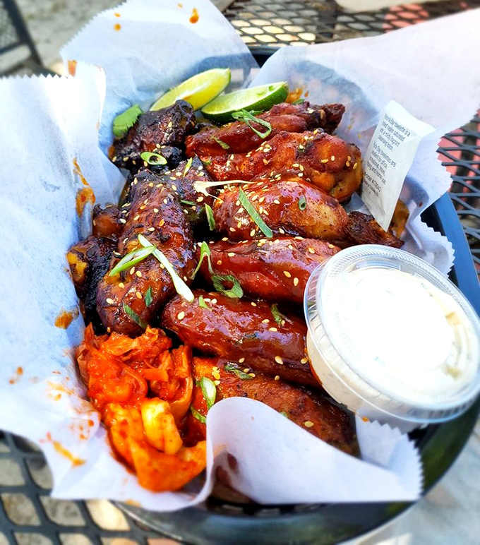 These wings aren't playing around—they've dressed up in their finest gochujang glaze and brought kimchi to the party.