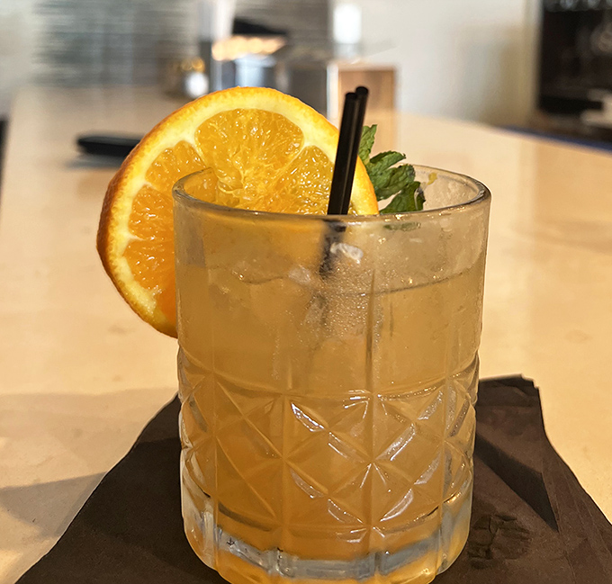 A cocktail that looks like liquid sunshine. This refreshing citrus concoction proves drinks can be both photogenic and potent.