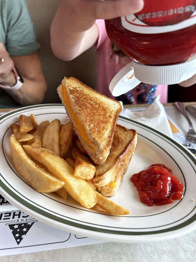 Not just any grilled cheese &ndash; this is the platonic ideal: perfectly golden exterior, molten interior, and that little squeeze of ketchup waiting patiently for its moment.