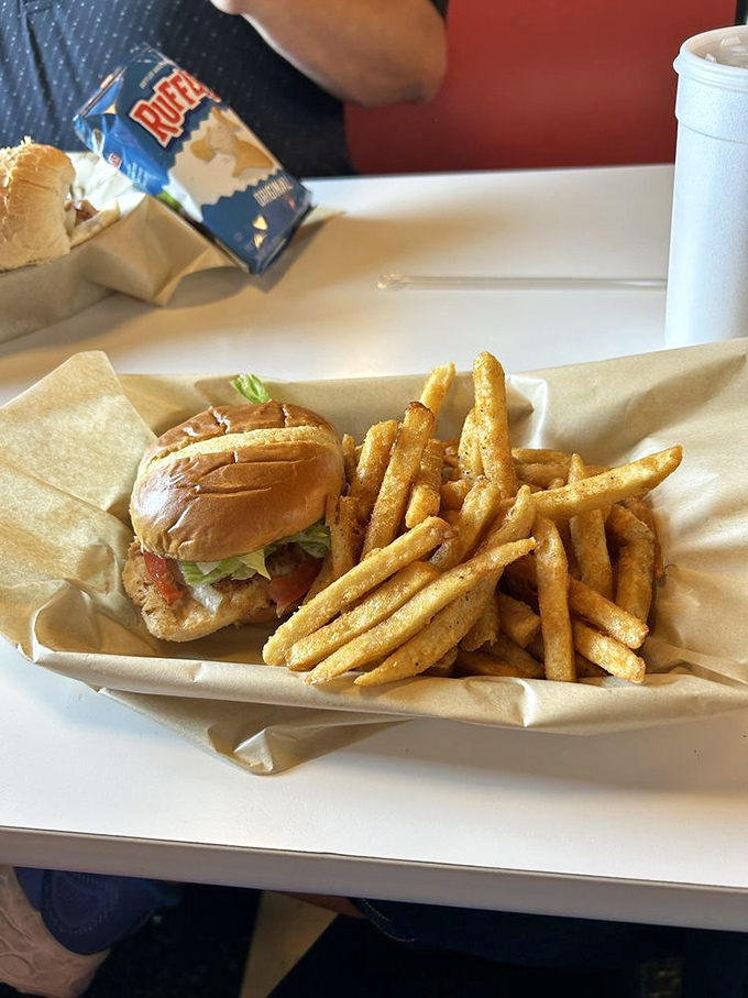 Sometimes the simplest pleasures win &ndash; fresh lettuce, tomato and grilled chicken on a roll that knows its supporting role perfectly.