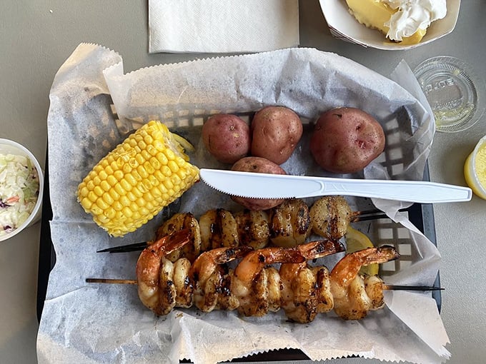 Grilled shrimp and scallops on skewers, proving that sometimes the best seasoning is just fire, smoke, and ocean-fresh flavor.