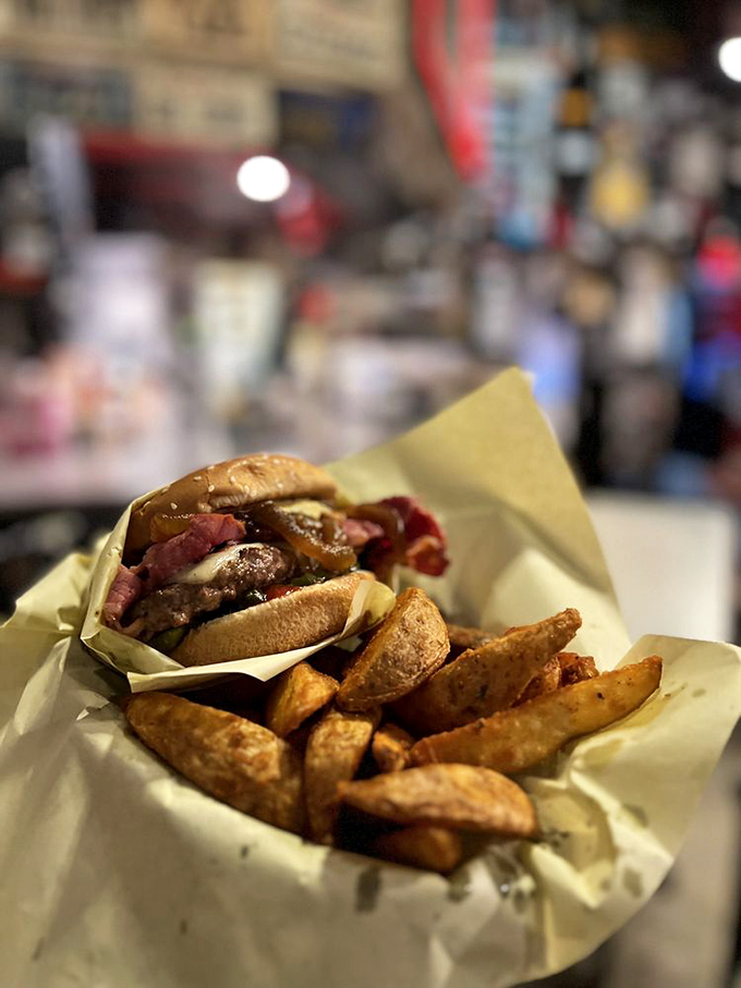 The Guido burger arrives with fries, creating a meal that satisfies both hunger and soul.