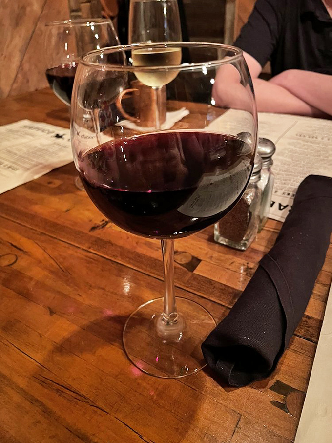 House wine that pairs beautifully with conversation, laughter, and the gentle glow of candlelight ambiance.