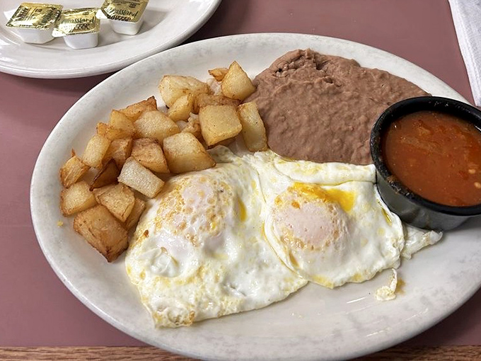 Sunny-side eggs with ranchero sauce that could wake the dead. The breakfast of champions who plan on going back to bed afterward.