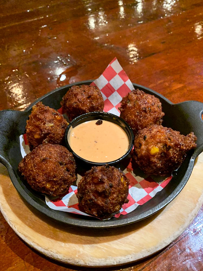 Hush puppies that would make a Southerner weep with joy. These golden orbs of cornmeal perfection demand a moment of reverential silence.