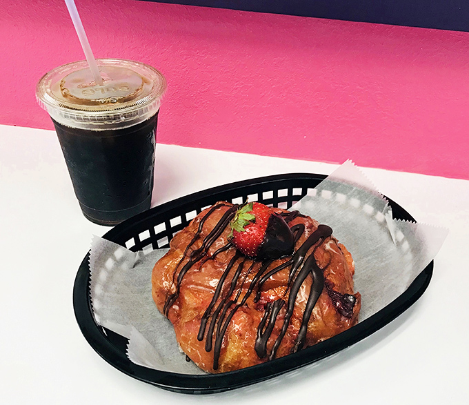 The perfect pairing: strong iced coffee alongside a strawberry-topped pastry. Some relationships are complicated; this one is simply meant to be.