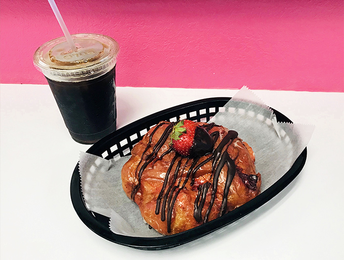 The chocolate-drizzled strawberry croissant paired with iced coffee &ndash; because sometimes breakfast should feel like dessert with permission.