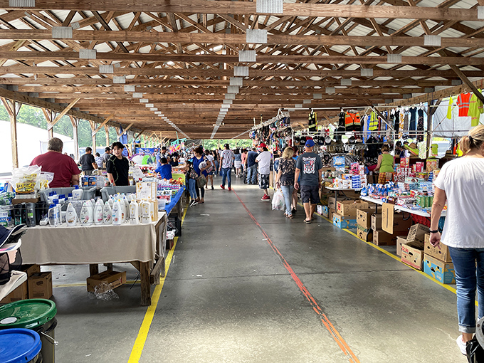 Main street under roof! The covered marketplace buzzes with weekend energy as shoppers hunt for deals along the well-organized vendor corridor.