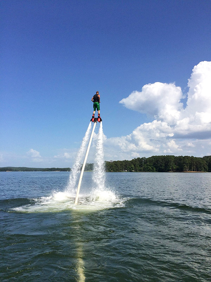 Modern adventure meets timeless waters as flyboarding transforms Lake Sinclair into a playground where gravity seems more like a suggestion than a law.