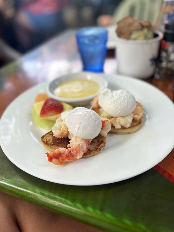Lobster benedict that makes you question every other breakfast you've ever eaten. Those poached eggs look like they're floating on cloud nine.