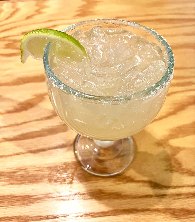 The margarita&mdash;tart, strong, and sporting a salt rim that would make the Dead Sea jealous. Lime wedge standing by for duty.