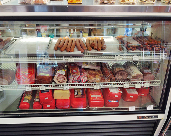 Behind this glass lies the sausage sanctuary &ndash; where kielbasa dreams come true and diet plans go to die.