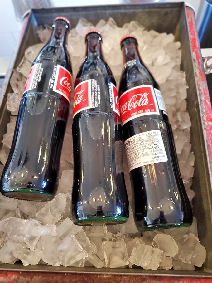 Mexican Colas lounging in their ice bath like celebrities at a spa&mdash;real sugar, glass bottles, and a taste that makes regular sodas seem like they're not even trying.