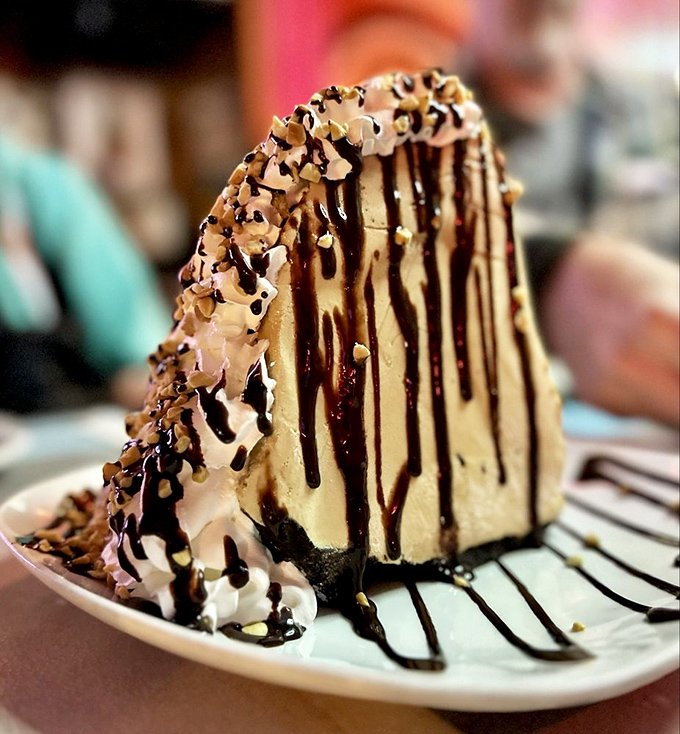 This isn't just dessert; it's an architectural achievement of chocolate, cream, and nuts that demands to be photographed before it's devoured.