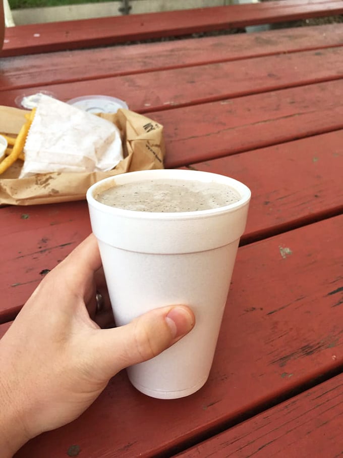 A proper milkshake should require serious straw strength. This frosty delight in a styrofoam cup passes the thickness test with flying colors. 