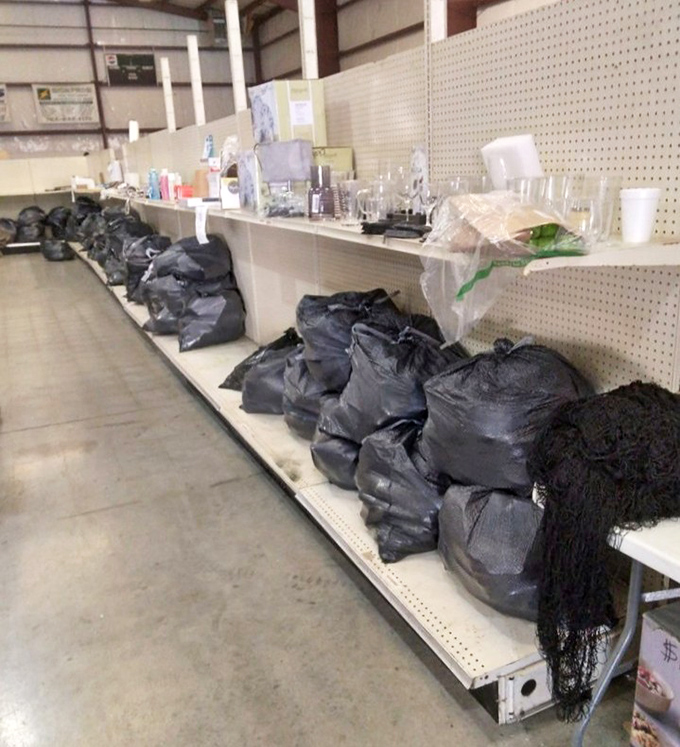 Mystery bags line the shelves like modern-day grab bags for grown-ups. What's inside? Only the brave will discover the secrets within these black bundles.