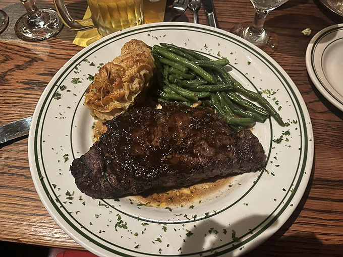A New York strip that's traveled west but kept its East Coast attitude, flanked by a twice-baked potato that's living its best, most indulgent life.