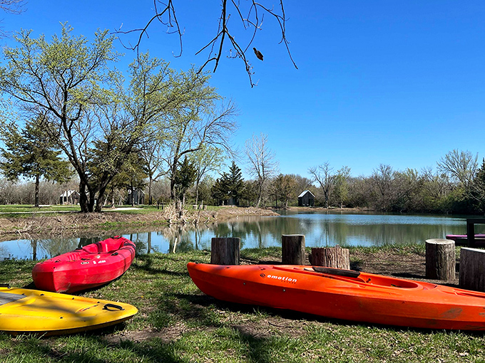Kayaks waiting by the shore like colorful candies&mdash;red, orange, yellow&mdash;promising sweet adventures on waters that reflect the Kansas sky.