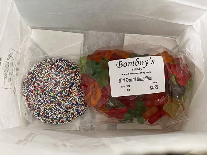 Chocolate nonpareils and gummy butterflies sharing a box like unlikely roommates in a sitcom. One crunchy, one chewy&mdash;both irresistible.