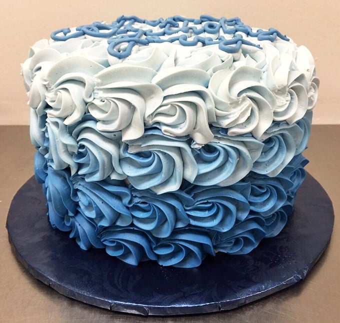 This blue ombre cake isn't just dessert, it's performance art. The perfectly piped rosettes would make even the most stoic baker weep with joy.