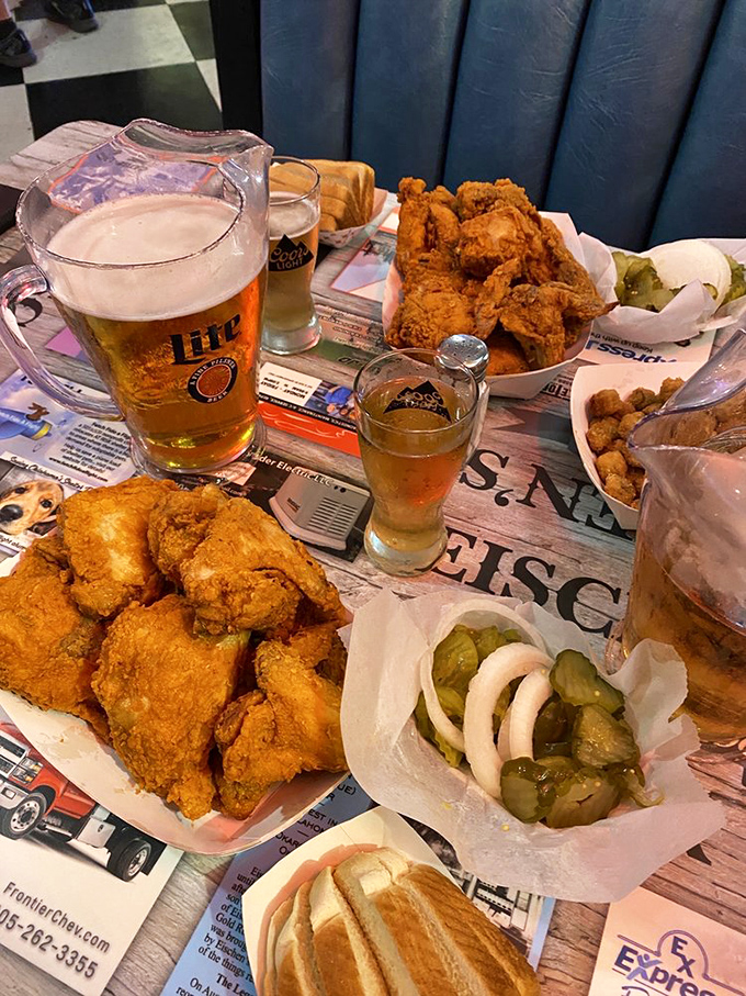 The ideal table spread at Eischen's - cold beer meeting hot chicken in a romance that's lasted longer than most Hollywood marriages.