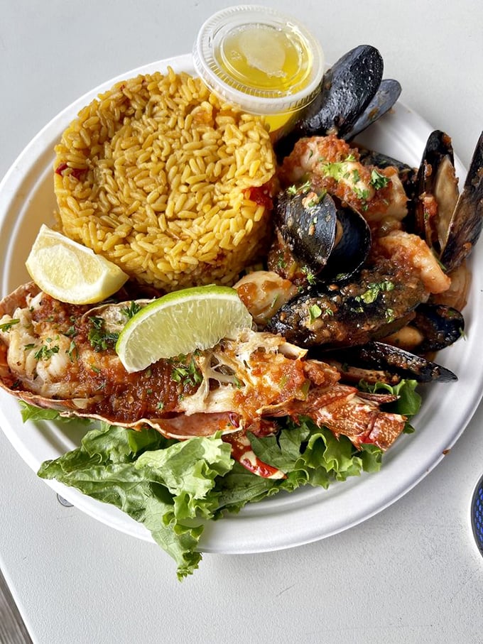Seafood paella that would make a Spanish grandmother nod in approval. Yellow rice cradles treasures from the sea alongside colorful vegetables.