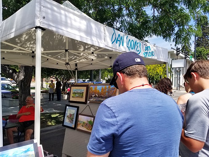 Local artists turn market stalls into impromptu galleries, where Idaho landscapes leap from canvas to capture the state's rugged beauty.