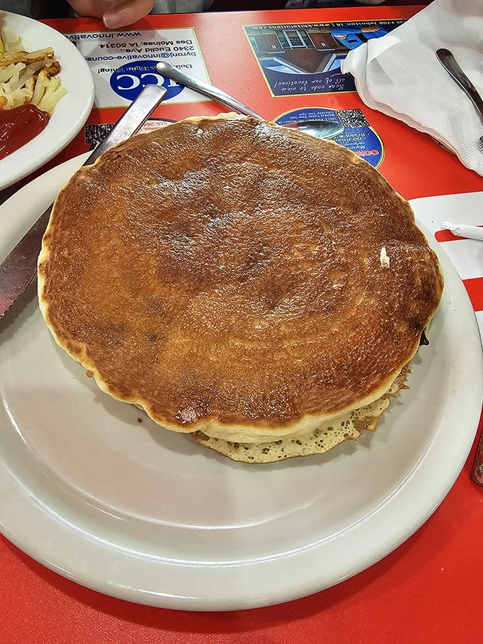 This pancake isn't just big&mdash;it's the solar system of breakfast, with its own gravitational pull and enough surface area for syrup exploration.