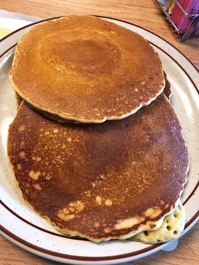 Pancakes with the perfect golden-brown exterior that makes you pause to admire before diving in. Breakfast artistry at its finest.