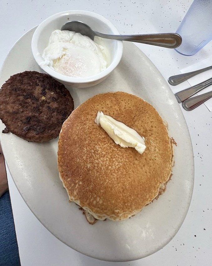 Pancake perfection with a side of nostalgia. That butter slowly melting into golden flapjack heaven takes you back to when breakfast wasn't just a meal, but an event.