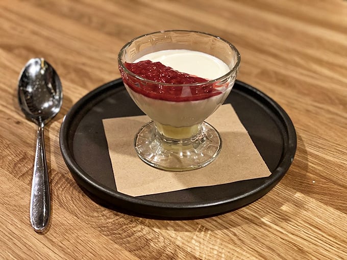 Elegant panna cotta with berry compote - the kind of dessert that makes you forget about calories entirely.