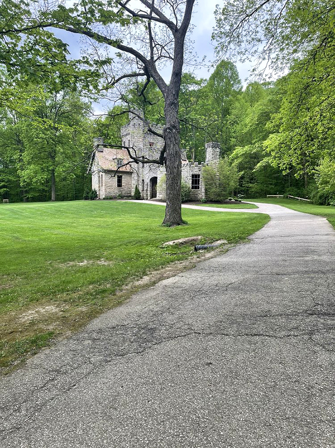 Nature reclaims its territory around the castle grounds, where winding paths invite explorers to discover what lies around the next bend.