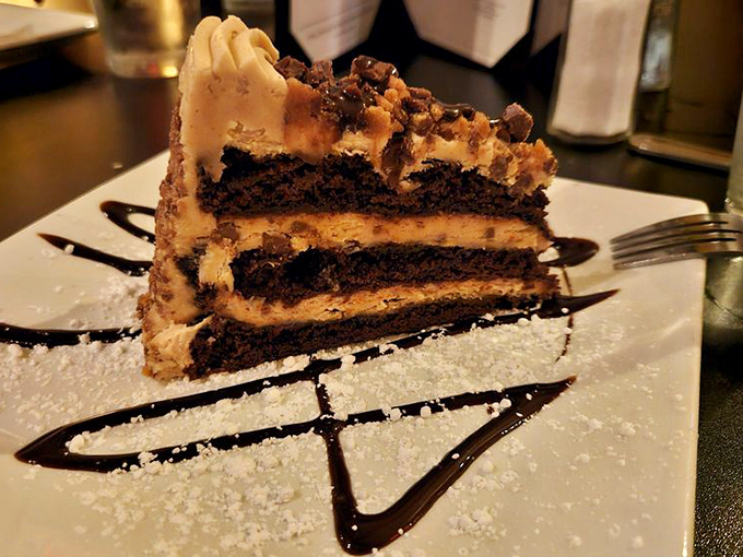 This towering chocolate peanut butter cake looks like it could solve world peace, one decadent bite at a time. 