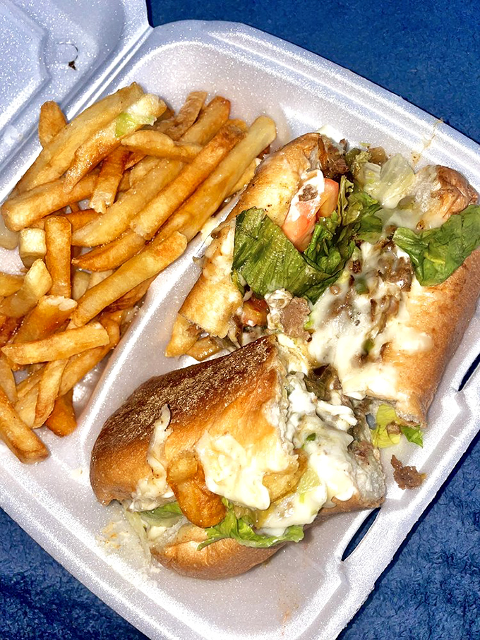 The juxtaposition of crispy fries against the melty, meaty cheesesteak creates the kind of contrast that food dreams are made of.