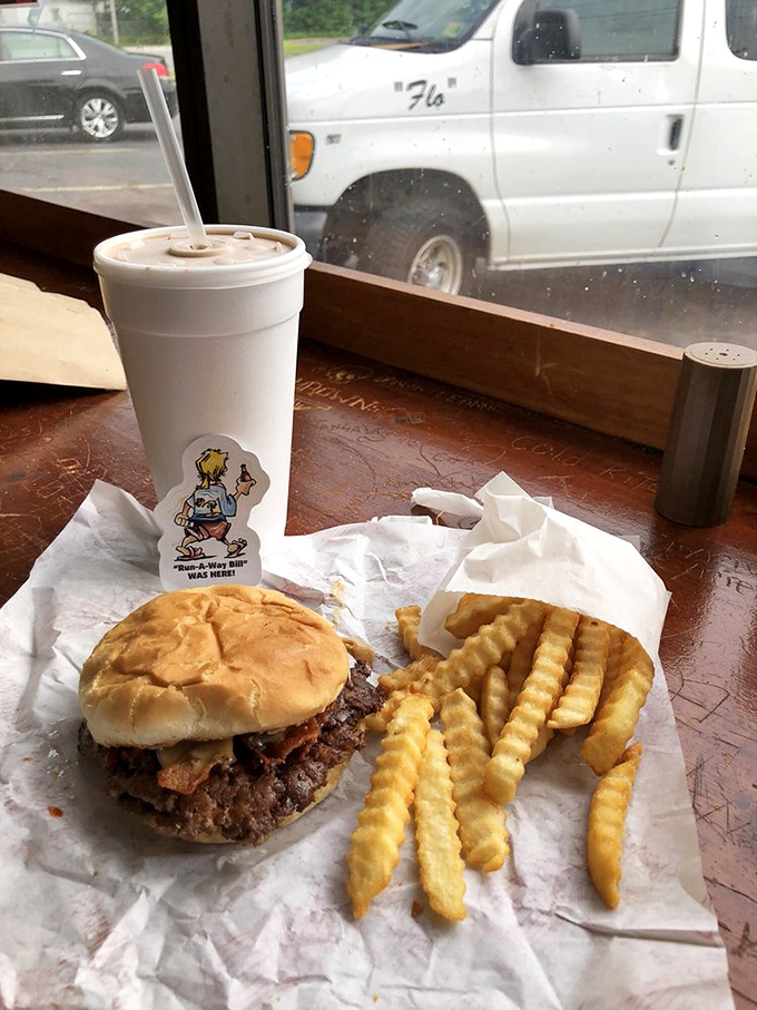 The classic American trinity: burger, fries, and soda &ndash; proof that happiness doesn't need to be complicated, just perfectly executed.