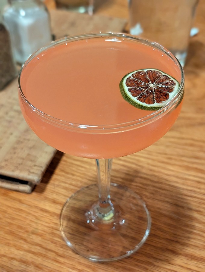 This blush-colored cocktail isn't just Instagram-worthy&mdash;it's a refreshing counterpoint to the rich comfort foods. The lime garnish adds just the right zing.
