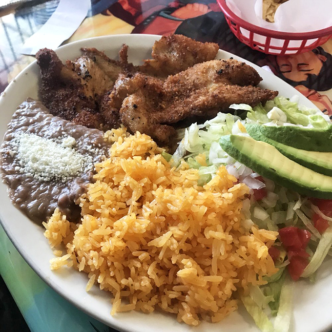 Milanesa: where chicken meets breadcrumbs and creates a beautiful friendship. That golden crust is what audible crunching sounds look like.